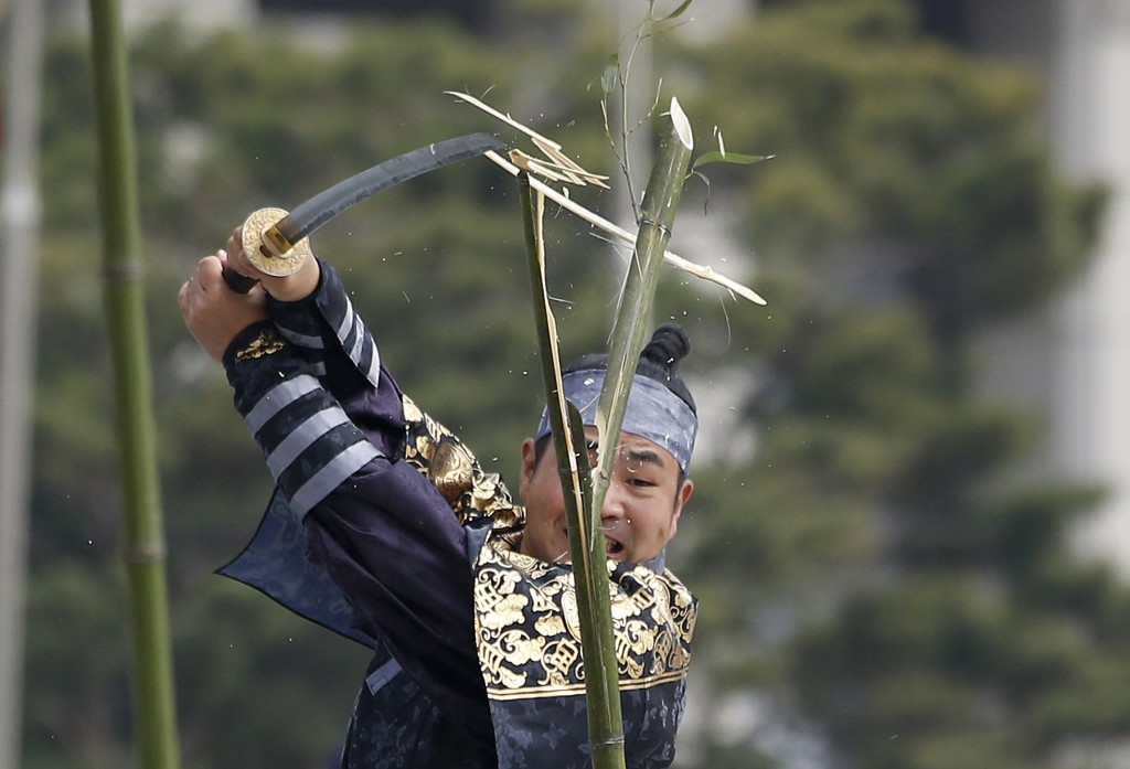 Man shoots sword wielding son